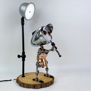 The Clarinetist in the Spotlight / Clarinet Player With Musical Dog ...