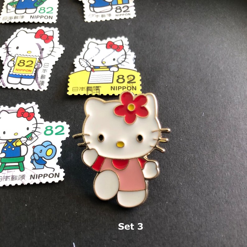 10 X Hello Kitty Postage Stamps and 1 Hello Kitty Pin/broche off Paper ...
