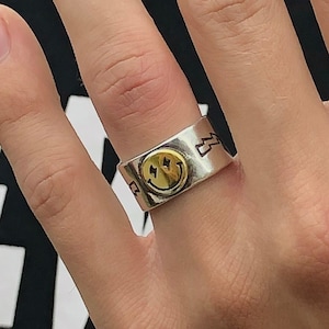 Smiley face lightning bolt ring store