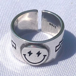 Smiley face lightning bolt ring store