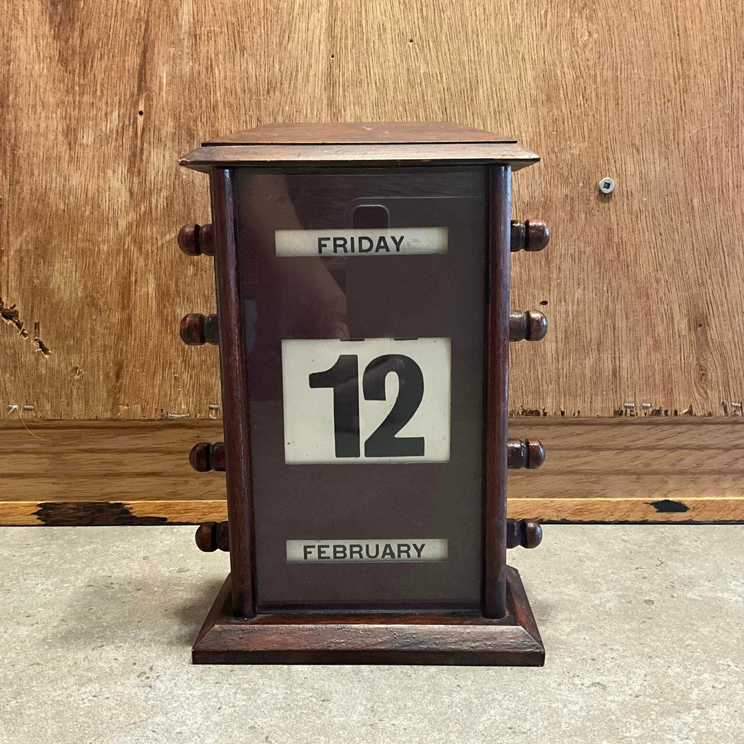 An Early 20th Century Replica Perpetual Desk Calendar, With Three ...