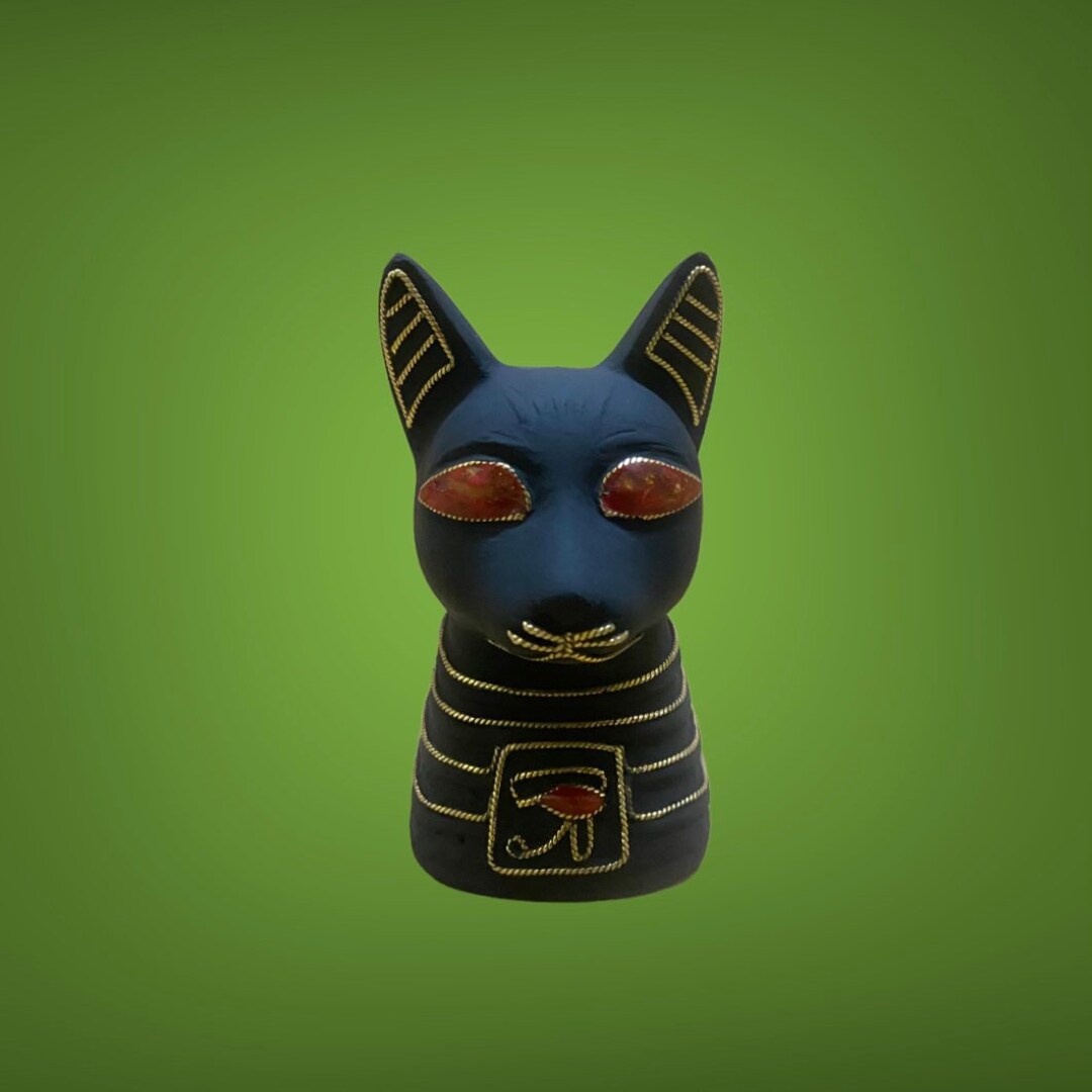 The Head of a Bastet Cat Inlaid With Amber and Copper is a ...