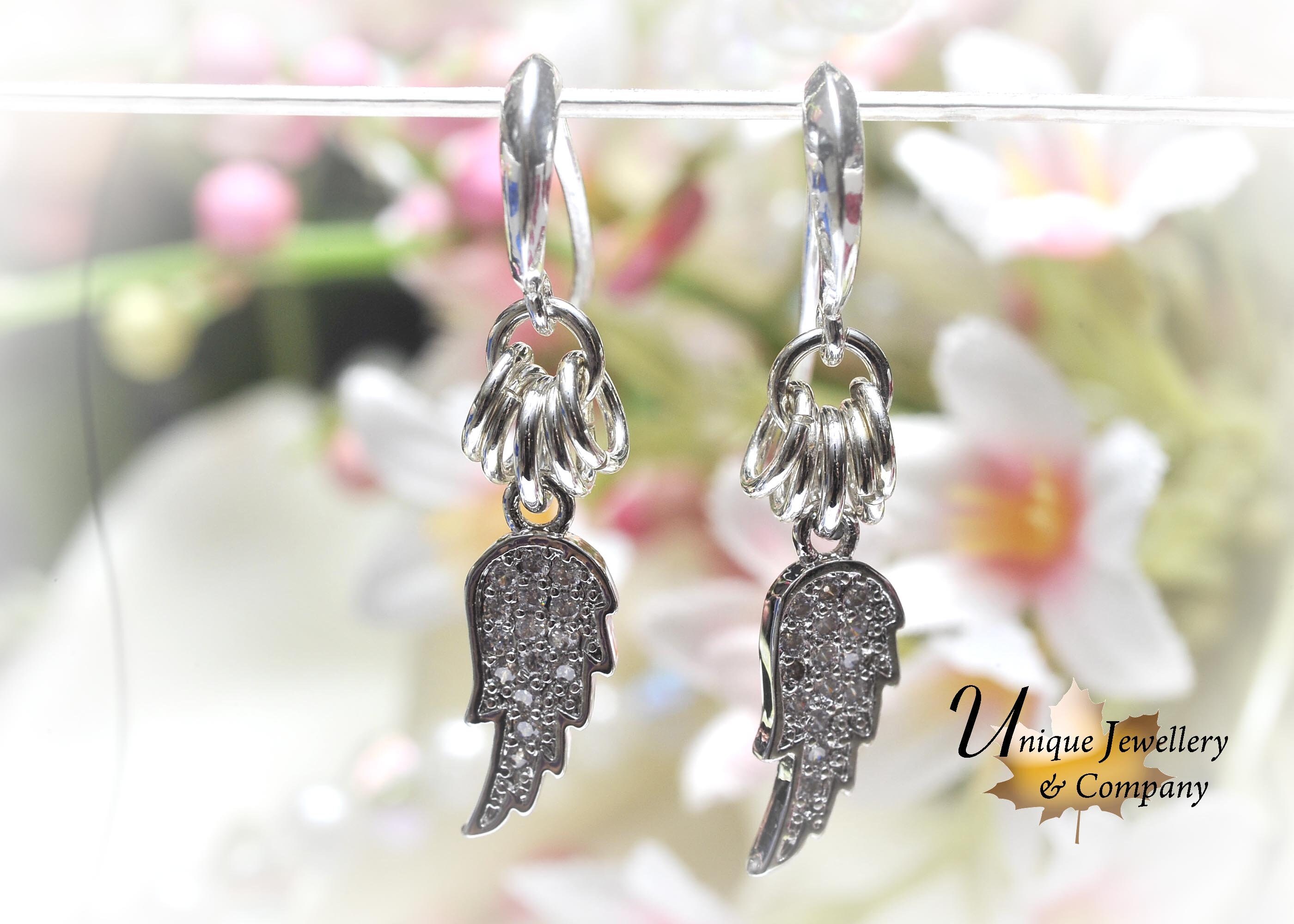 Pendientes de plumas de plata plateada / cristal de plata - Etsy España