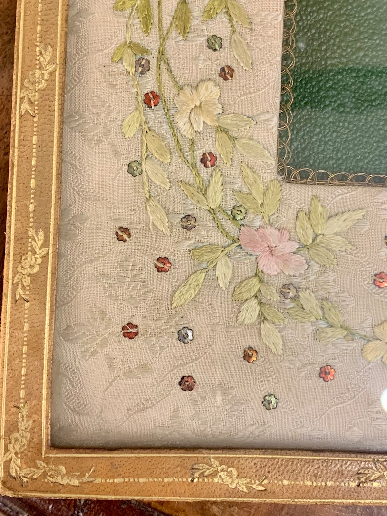An Antique French Embroidered Photo Frame With a Brown and Gold Leather ...