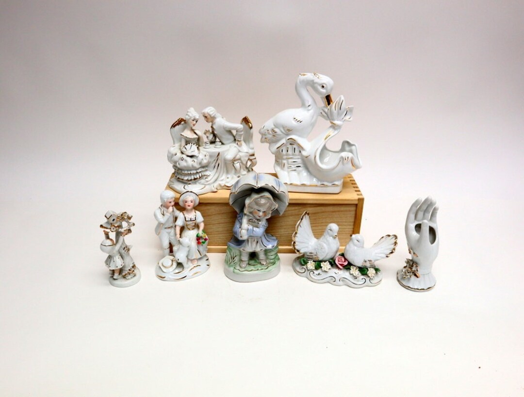 Collection With Seven Porcelain Figurines in Various Shapes and Sizes ...