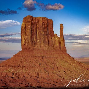 Monument Valley in Arizona is a Collection of Towering Sandstone Buttes ...
