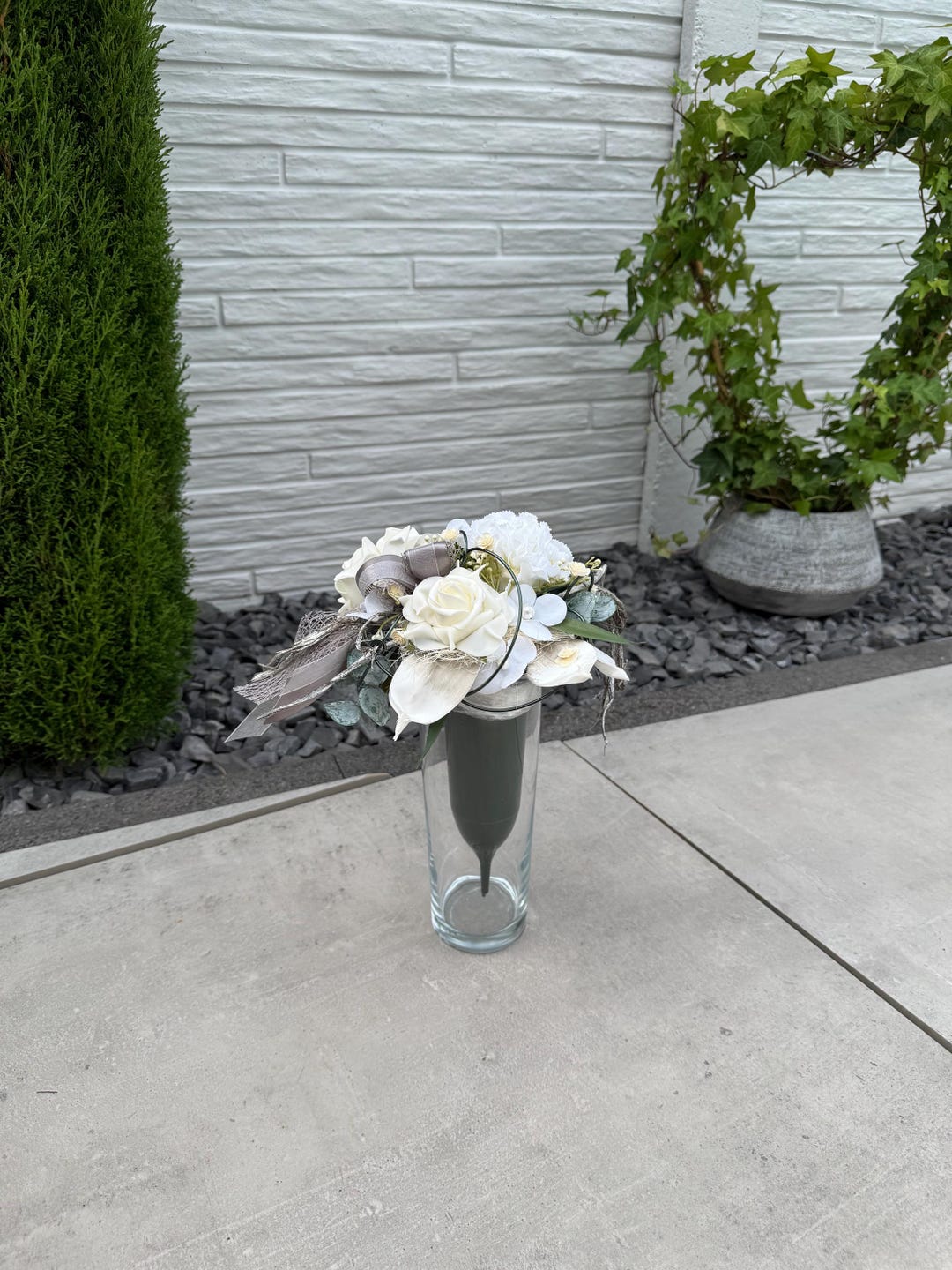 Grave Arrangement in a Vase With White Roses and a White Carnation ...