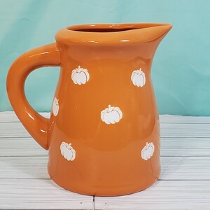 Terramotto Ceramic 40 Oz Dark Orange Fall Pitcher With White Pumpkin ...