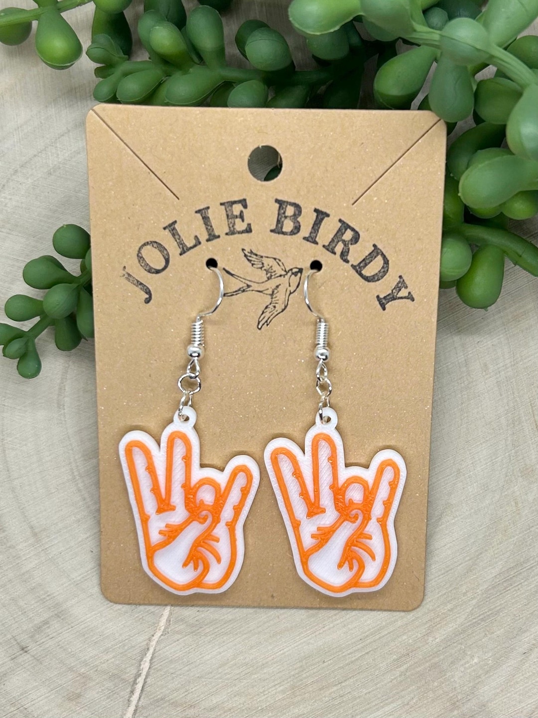 Give ‘em’ the Vol! Vol 4 Life Hand Sign Earrings! - University of ...