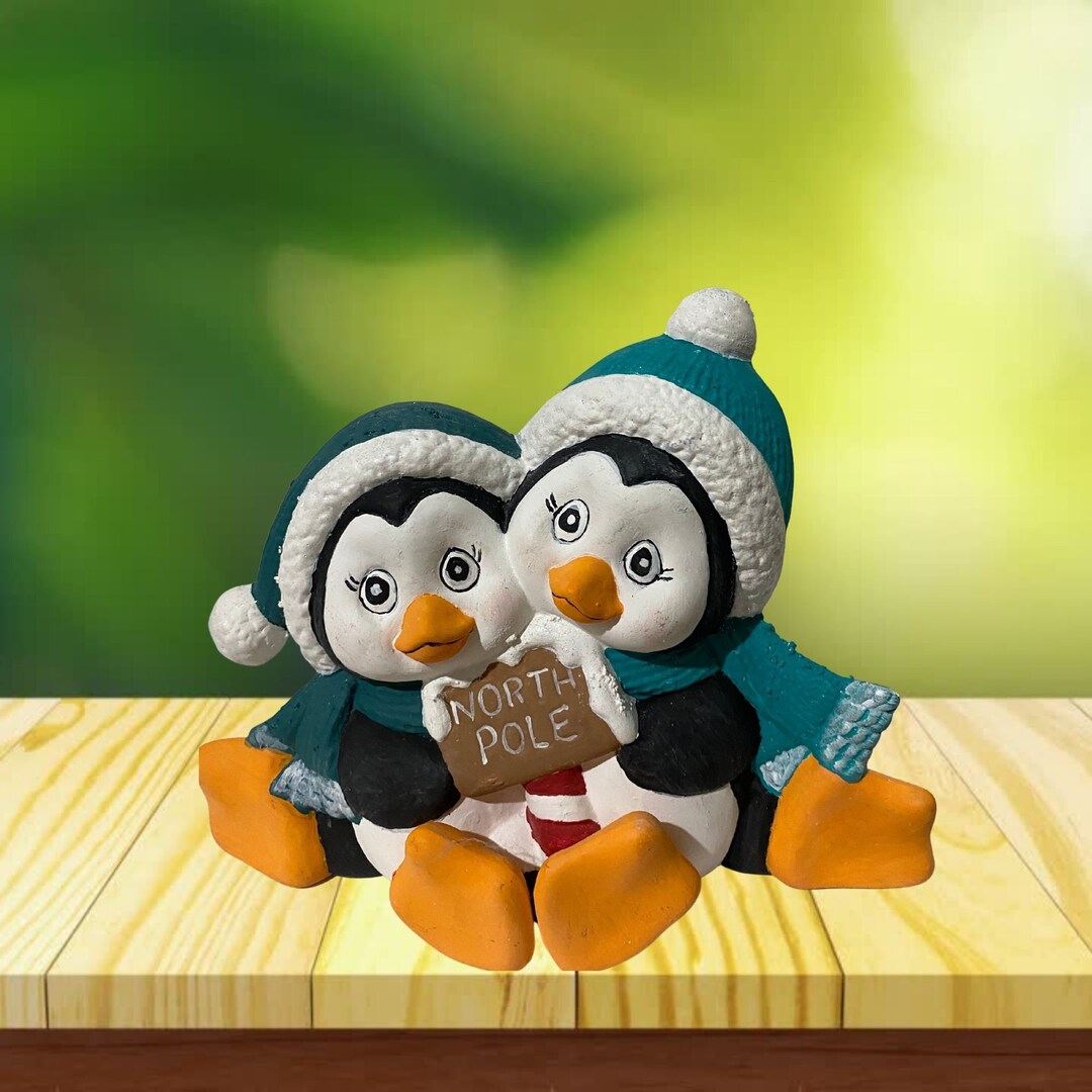 This Ceramic Figurine of a Black and White Cuddle Penguins Will Look ...