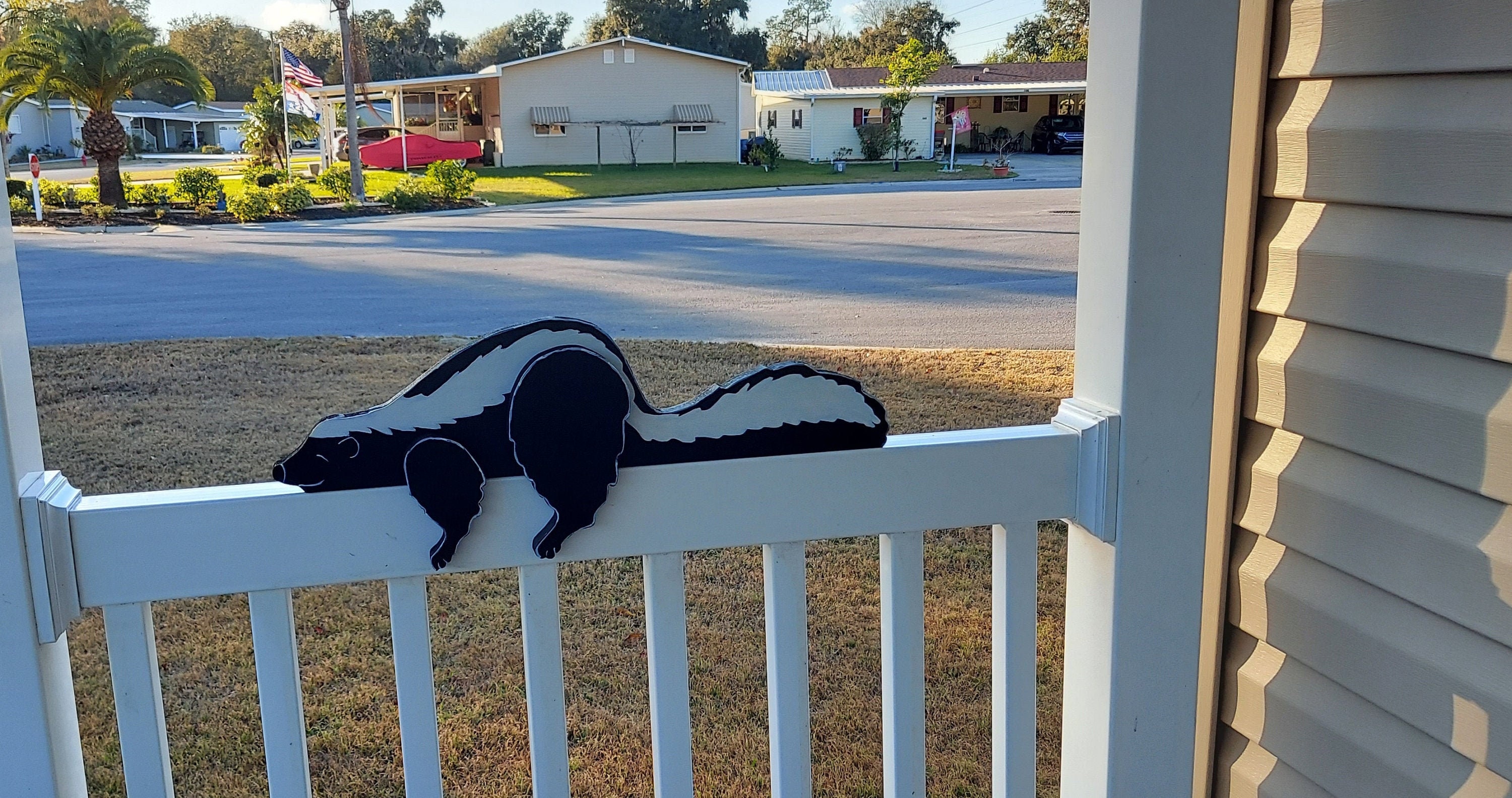 Wooden skunk outdoor decor skunk rail sitter skunk home | Etsy