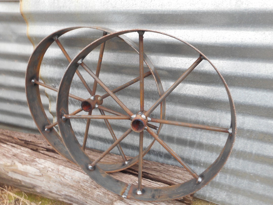 A Pair of 16" Steel Wagon Wheels , Rustic Art Bar B Q Pits Wagons Etc ...