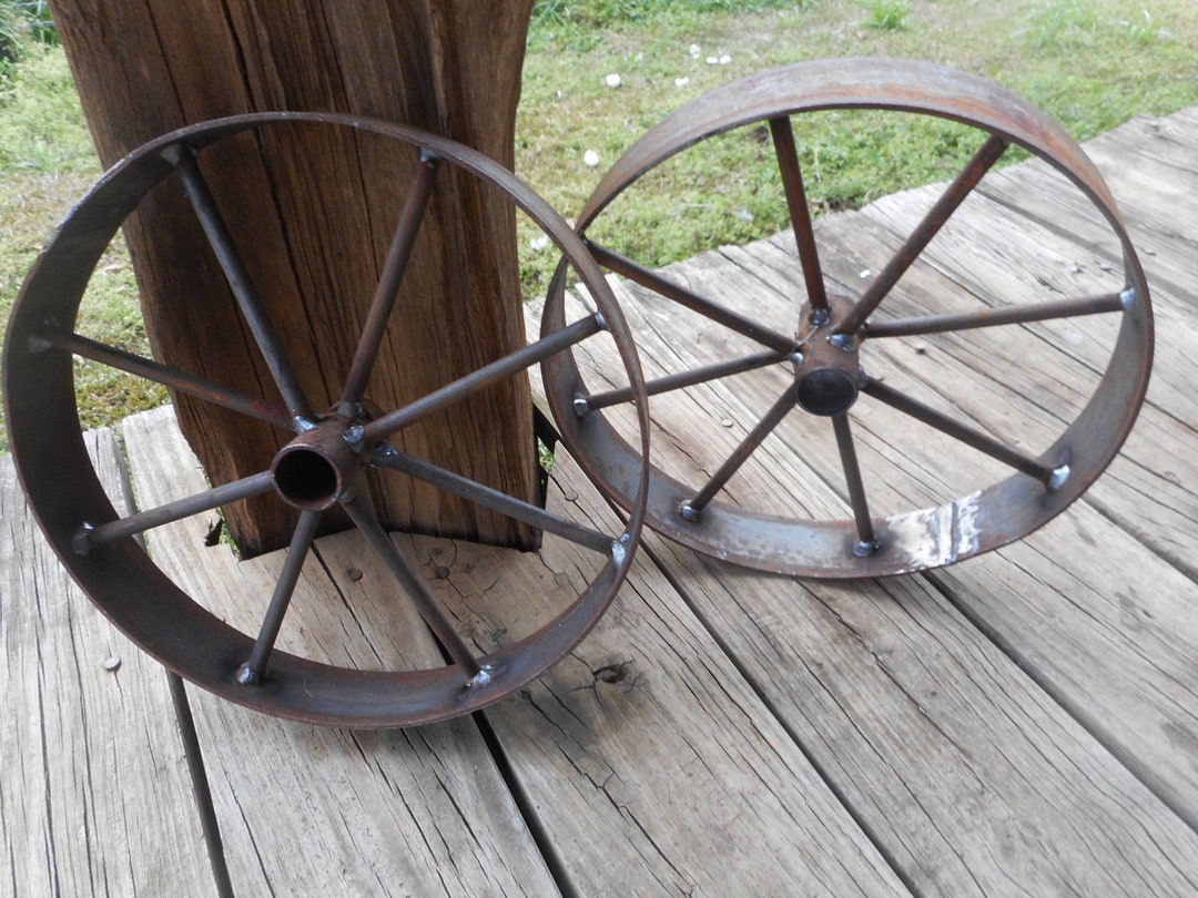 A Pair of 12" Steel Wagon Wheels , Rustic Art Bar B Que Pits Wagons Etc ...