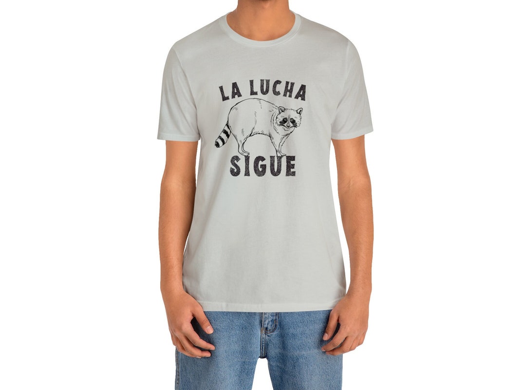 The Struggle Raccoon Spanish Language Comrade Bilingual La Lucha Sigue ...