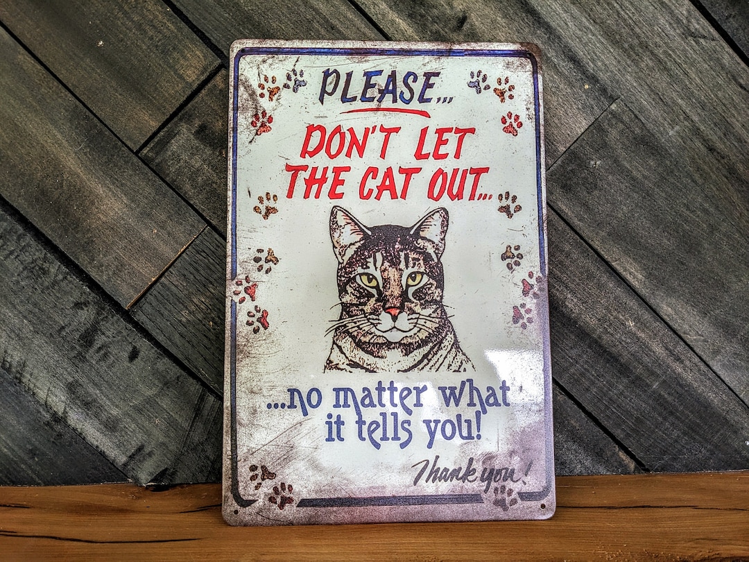 Funny Cat Sign Please Don't Let the Cat Out ... No Matter What It Tells ...