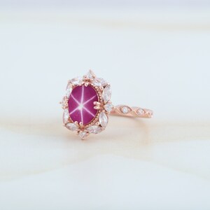 Unique Oval Cut Pink Star Ruby Engagement Ring Lindy Star Gemstone Ring Vintage Cluster Halo ...