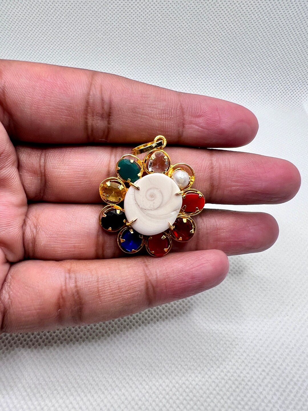 Navratna Gomti Chakra Locket: Harness the Power of Nine Gemstones for ...