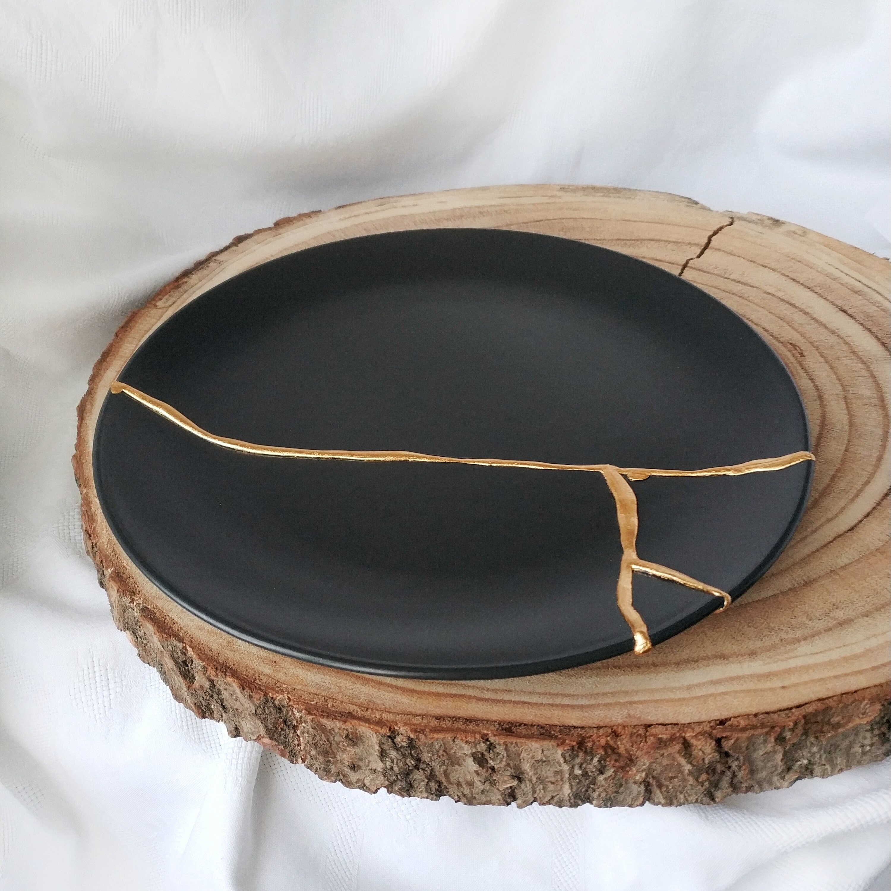 Ceramic Kintsugi plate matt black and gold hand mended | Etsy