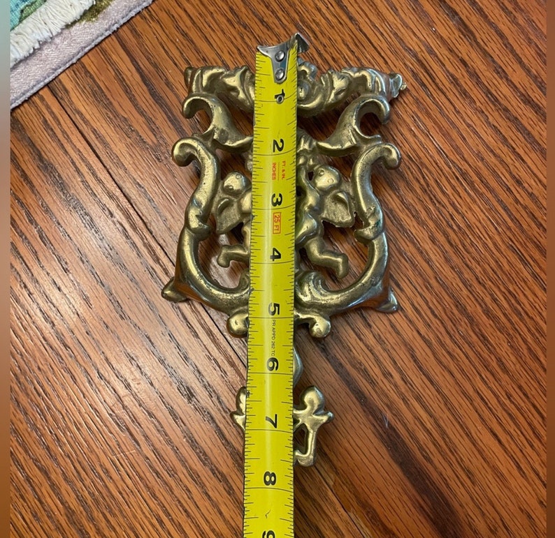 Vintage Footed Trivet in Gold - Ornate With Cherubs Cupids Scrolls ...