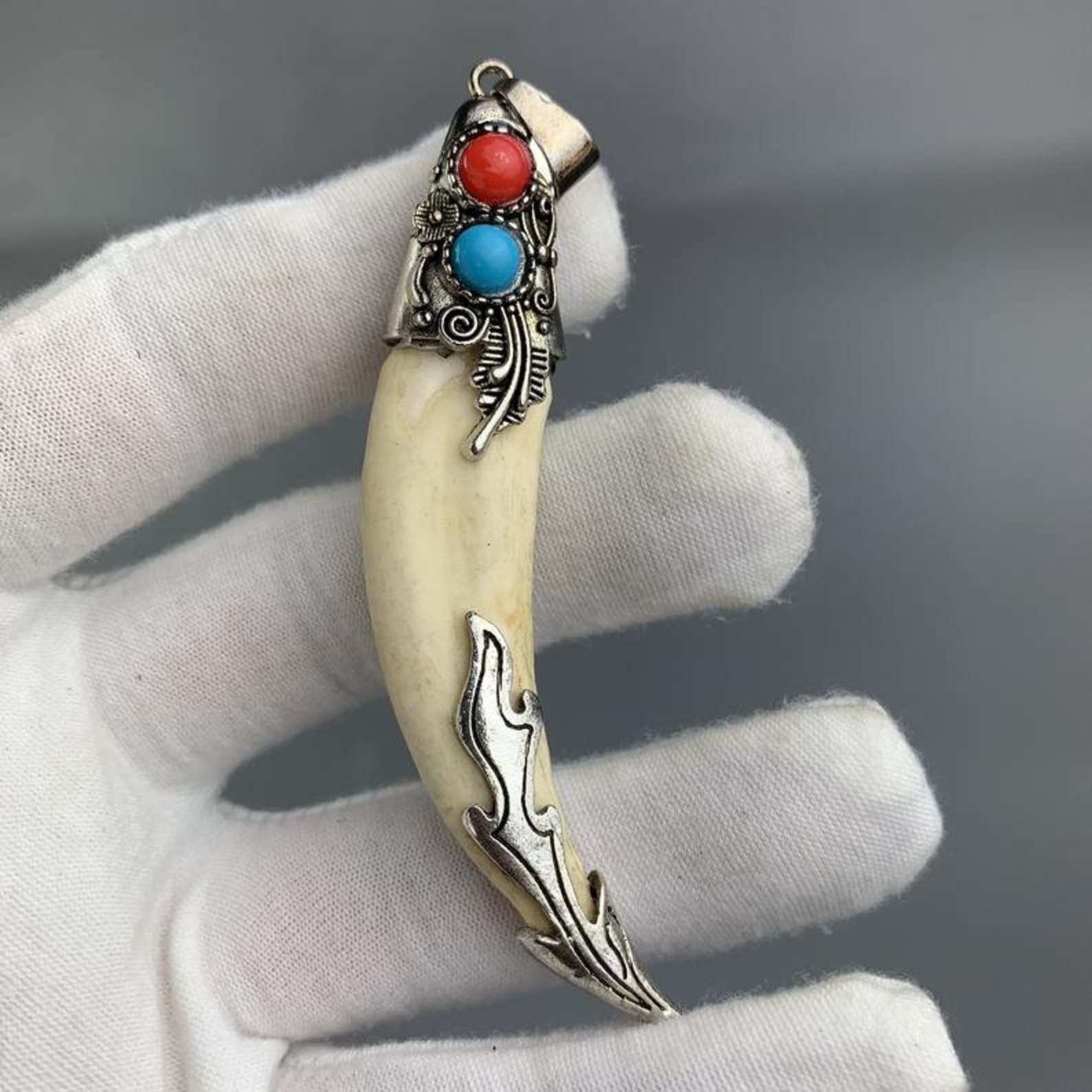 Real wolf tooth pendant inlaid with Tibetan silver | Etsy