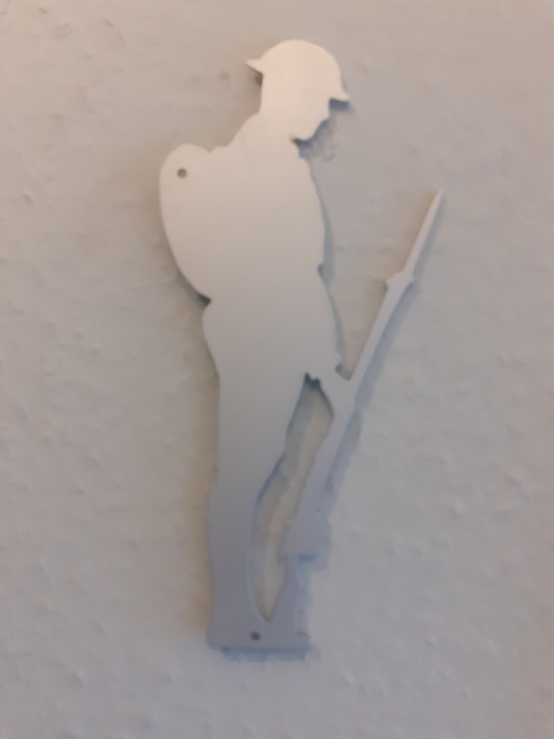 A Silver Coated Wood Silhouette Memorial Standing Soldier Figure to ...
