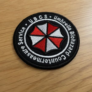 UBCS - Resident Evil - Umbrella Logo - Embroidered Patch - Iron/sew On ...