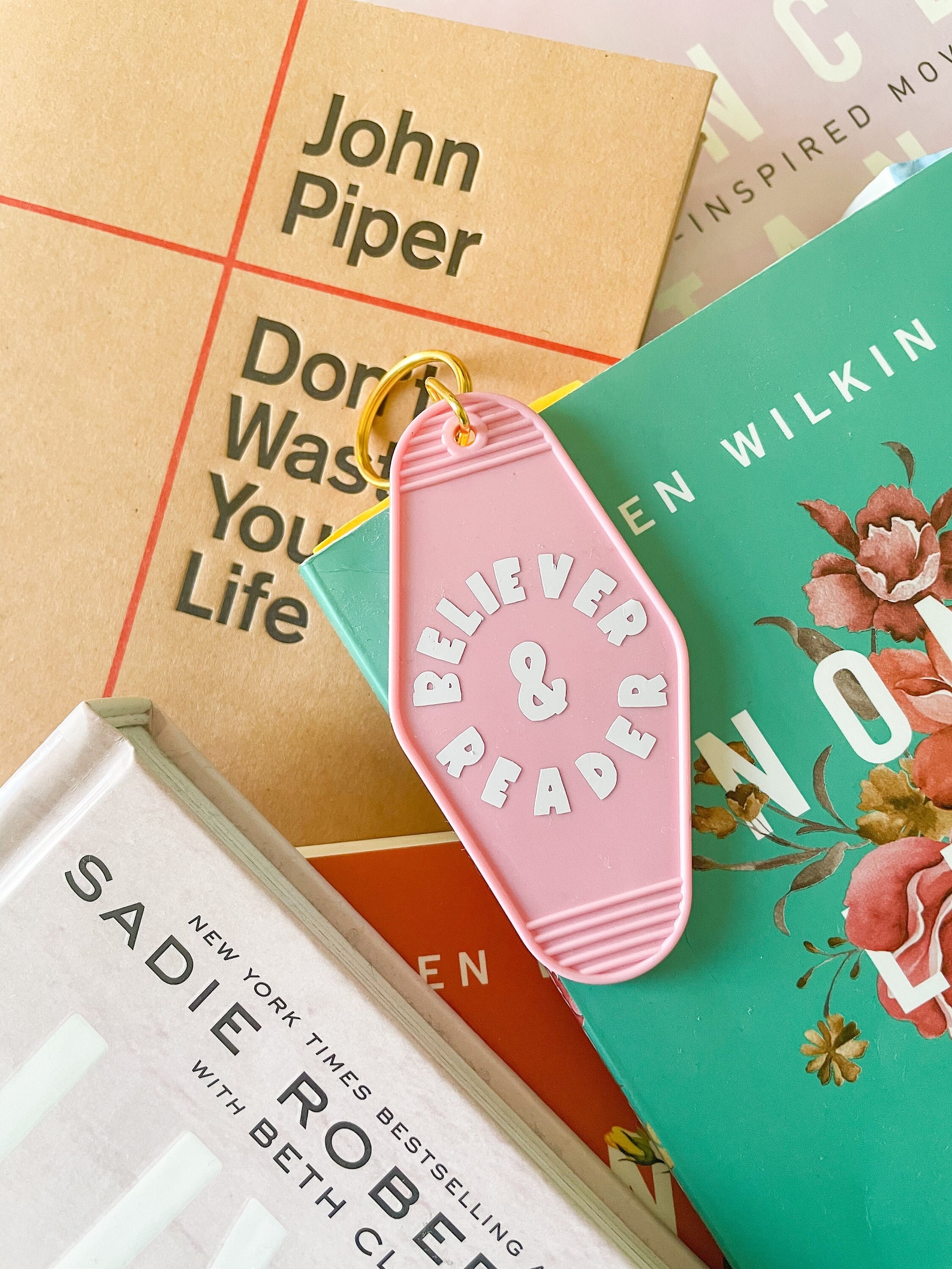 Divine Delight: Pink Motel Key Chain With Whimsical 'believer & Reader ...