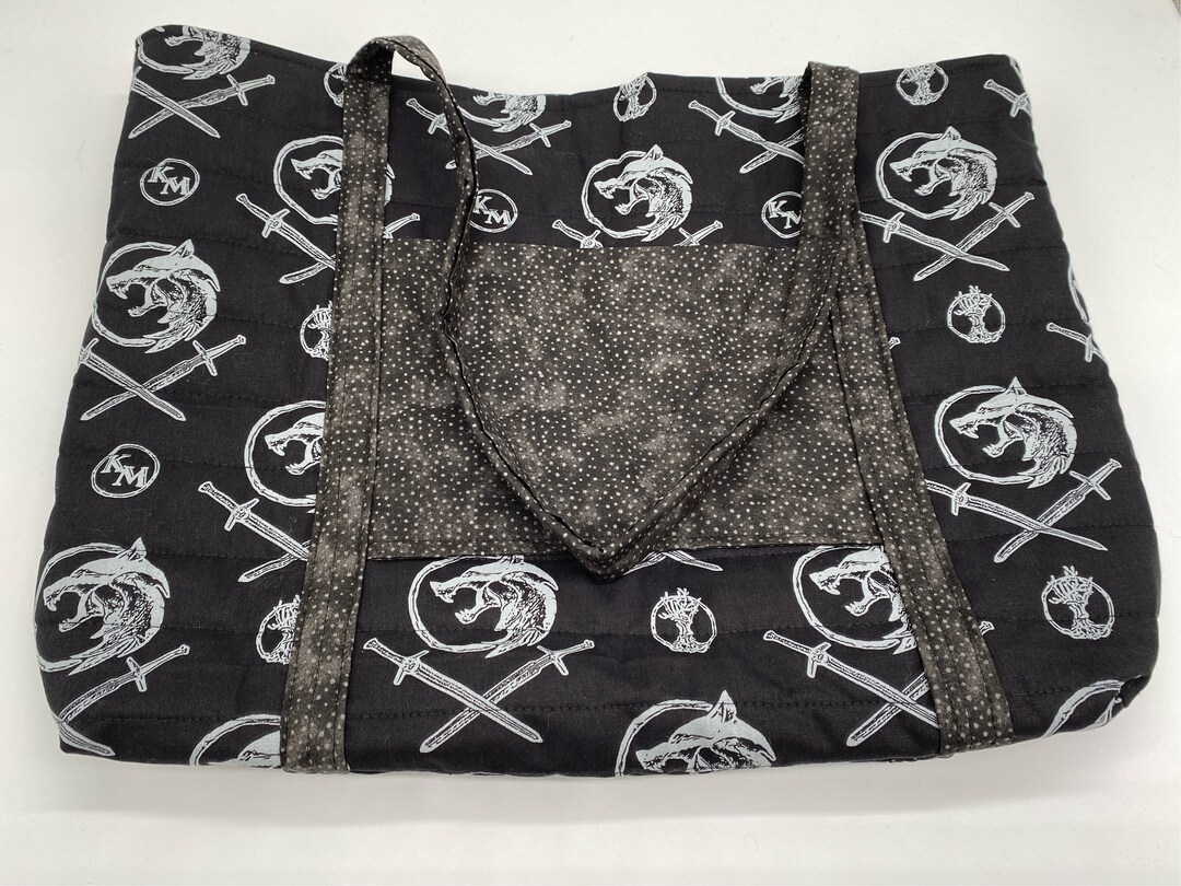 The Witcher Wolf and Crossed Swords Repeat Print Quilted Lined Cotton ...