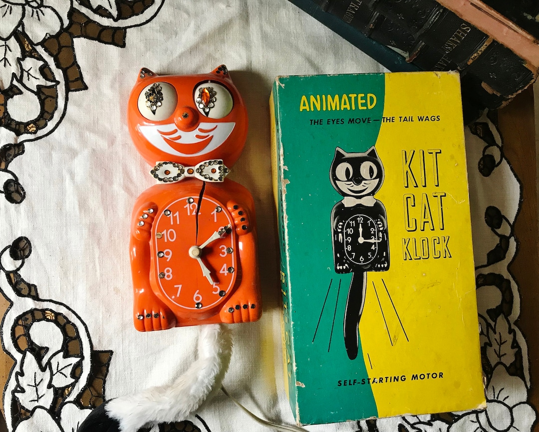 KIT CAT KLOCK, Vintage Felix the Cat, Orange Plastic With Crystals ...