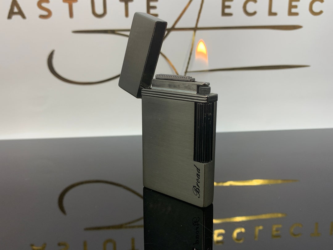 Slim Dark Lighter With Refillable Butane and Side Grind Flint in a Dark ...