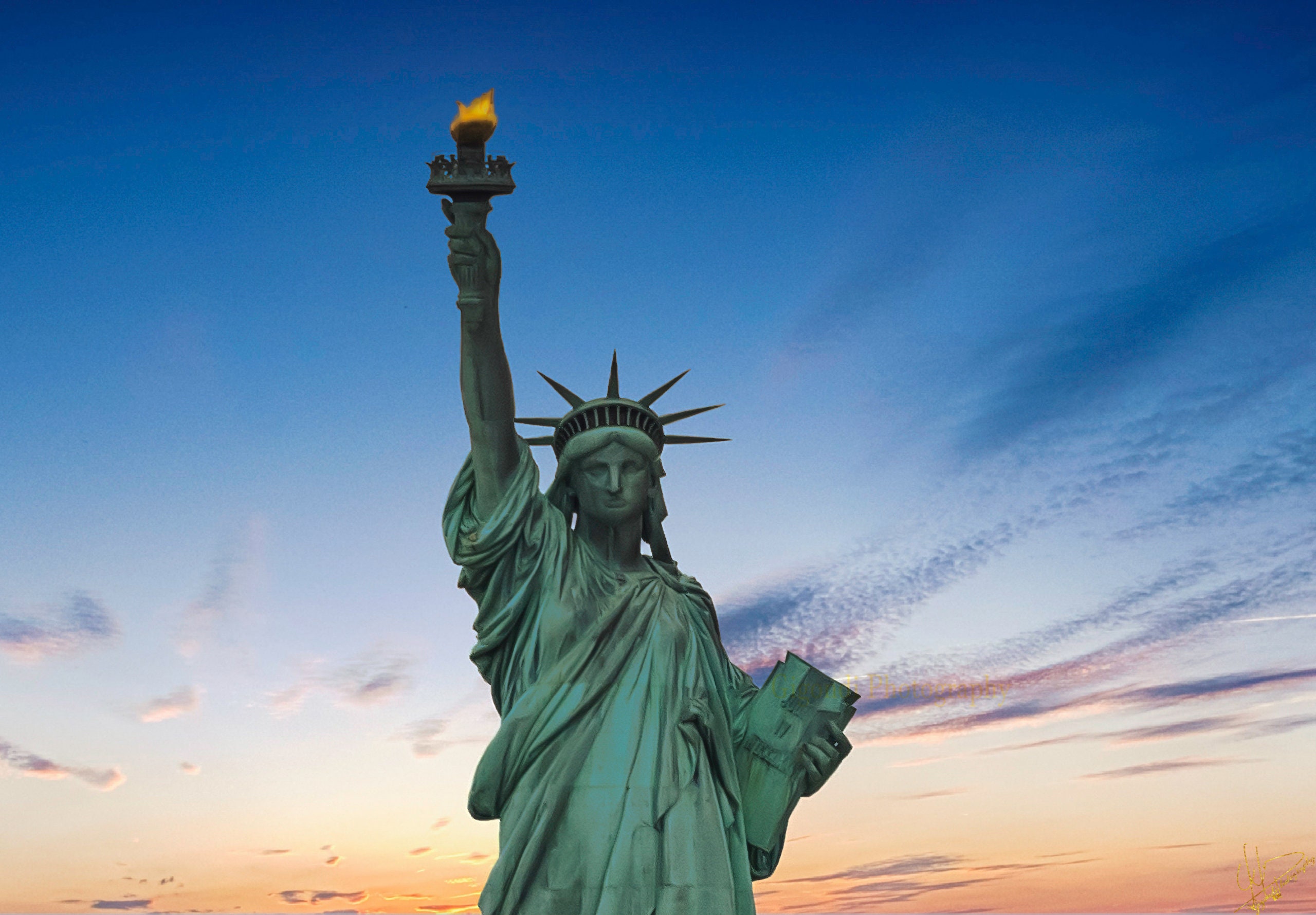 Statue Of Liberty At Sunset