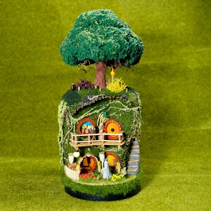 Hobbit's House With Growing Tree of Life. House With Lights Inside and ...