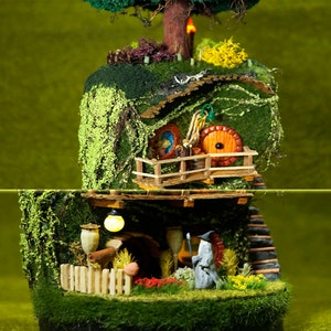 Hobbit's House With Growing Tree of Life. House With Lights Inside and ...