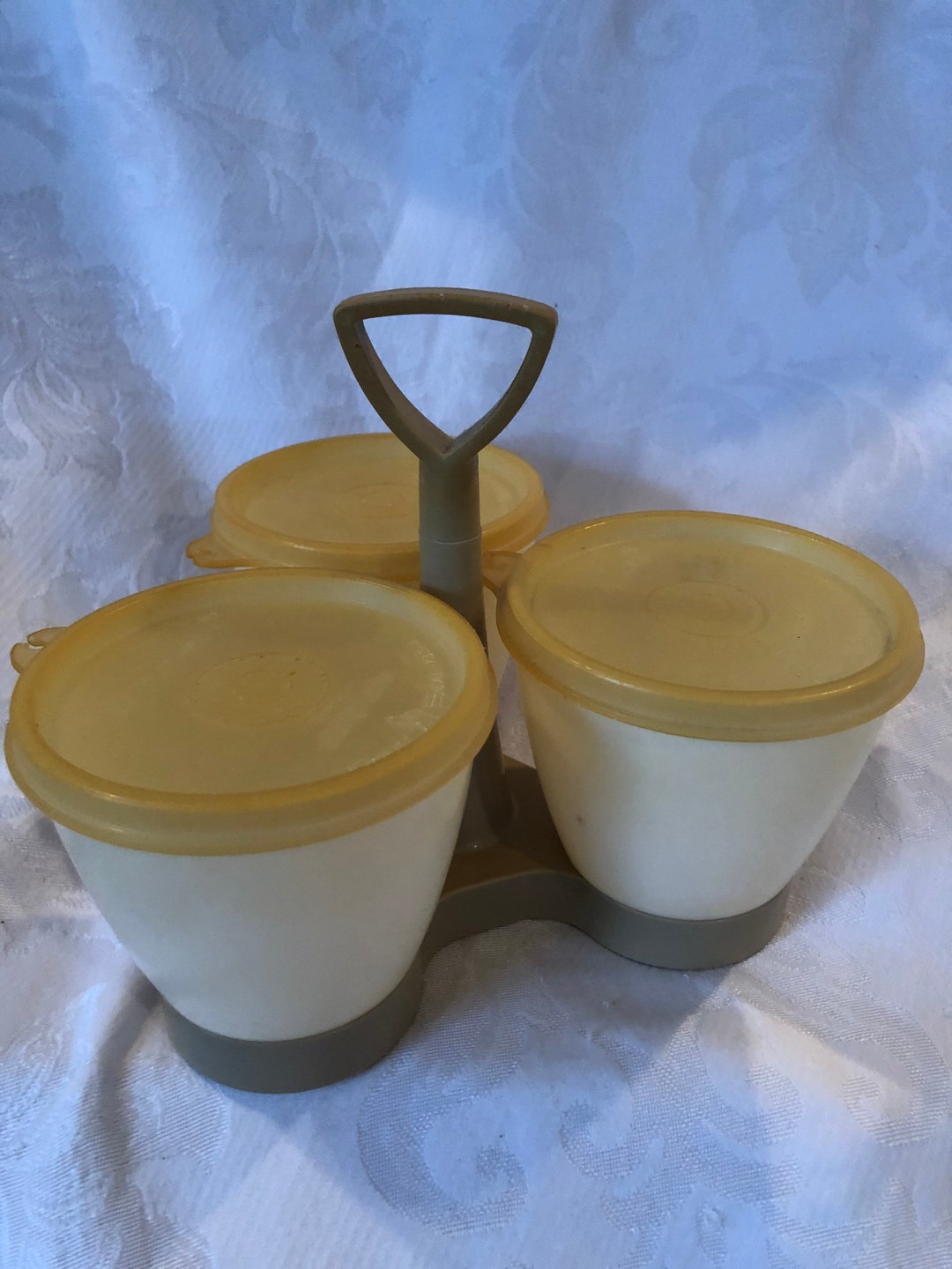 A Vintage Tupperware Condiments Container Stand With a Handle and Lids ...