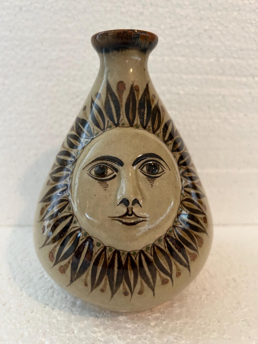A Vintage Pottery Art Vase Signed by Carlos Villanueva Depicting a Raised Sun Face Image on One ...