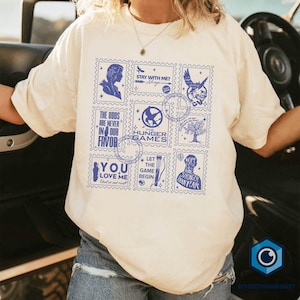 Vintage the Hunger Games Stamps Art Shirt | the Hunger Games Merch ...