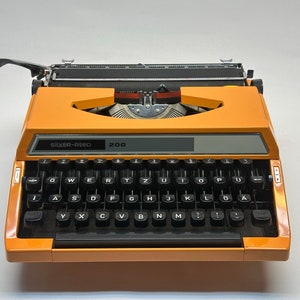 Vintage Elegance! Silver-reed Typewriter in Orange With Black QWERTZ ...