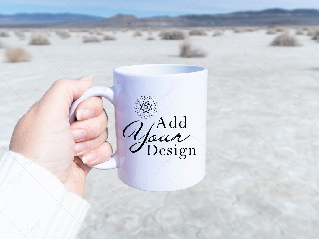 Mug Mockup, Woman Holding Mug With Arm Outstretched in Desert Setting ...