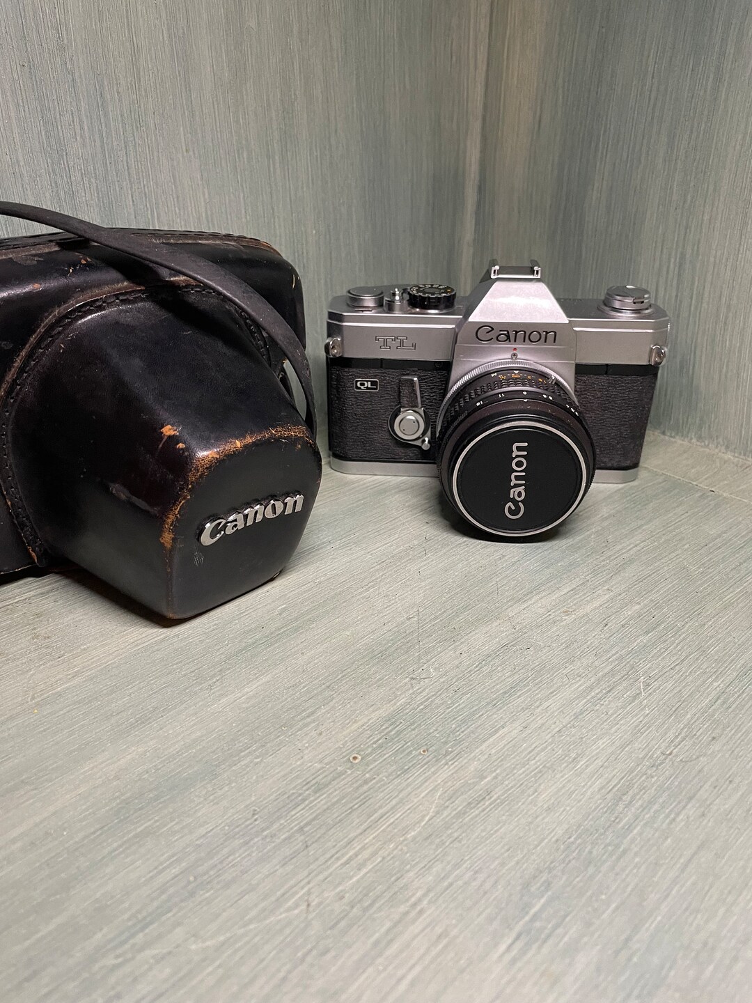 Canon TL QL 35mm Camera. Comes With Canon FL 35MM 1 : 3.5 Lens. Also Has Case With Strap and ...