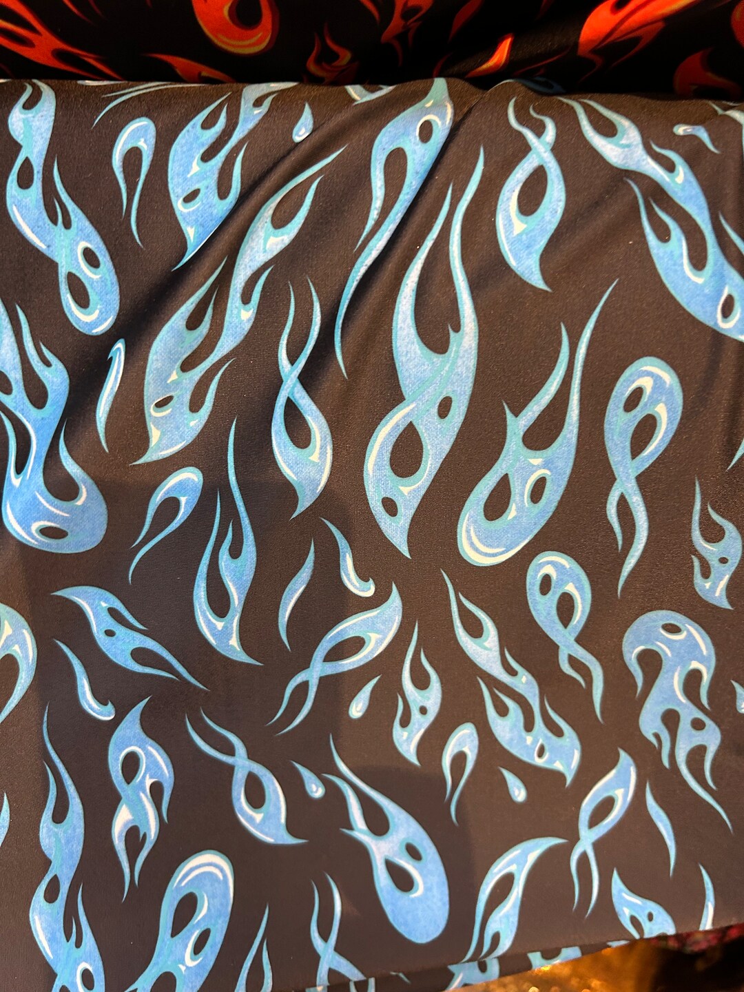 Blue Flames on Black Base Four Way Stretch Nylon Spandex Fabric Sold by ...