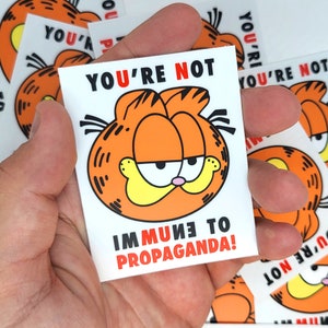 Propaganda Garfield Sticker You're Not Immune to Propaganda Garfield ...