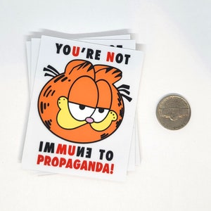 Propaganda Garfield Sticker You're Not Immune to Propaganda Garfield ...