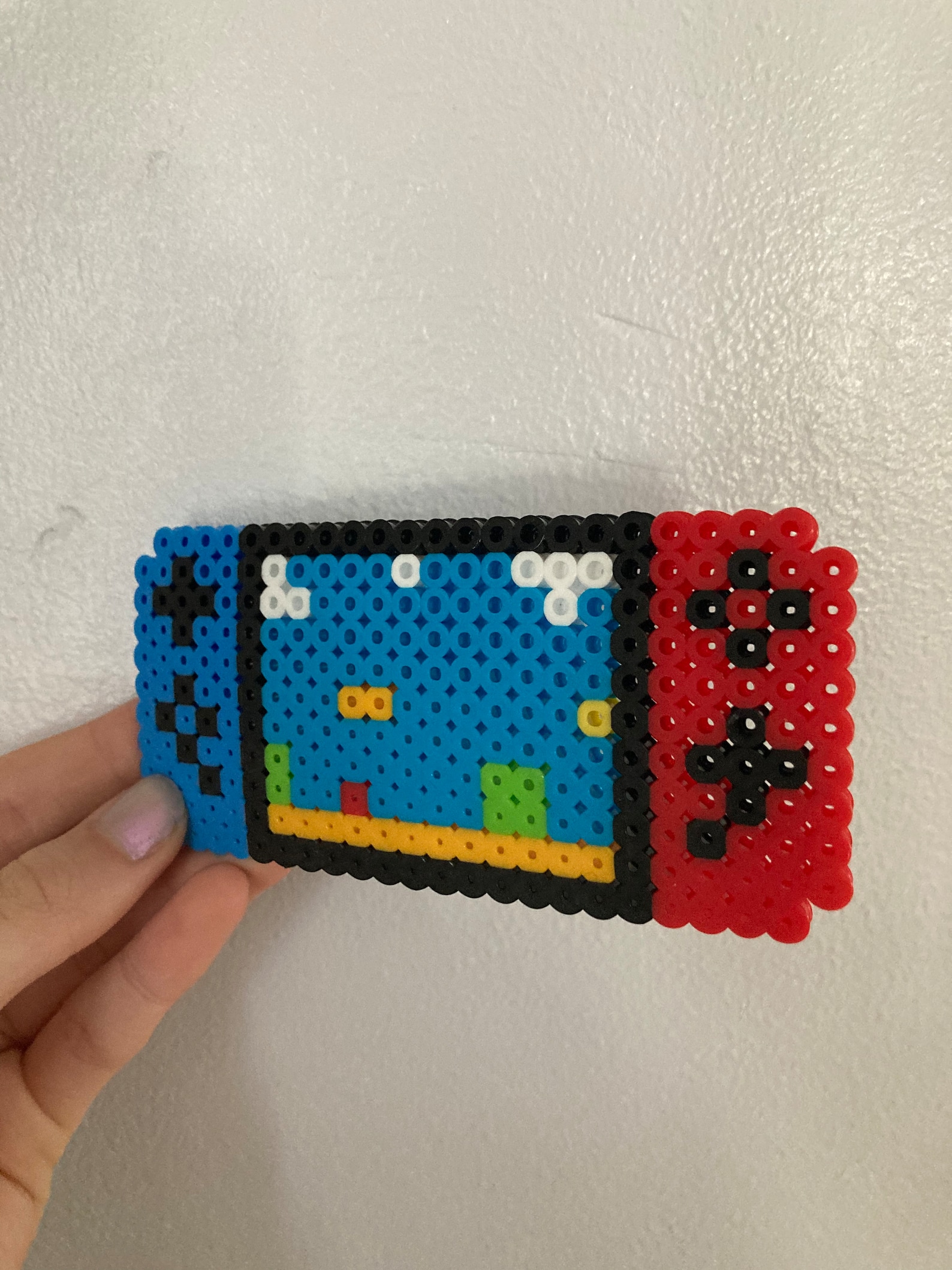 Cute Nintendo Switch Perler Bead Blue and Red With Mario in Background ...