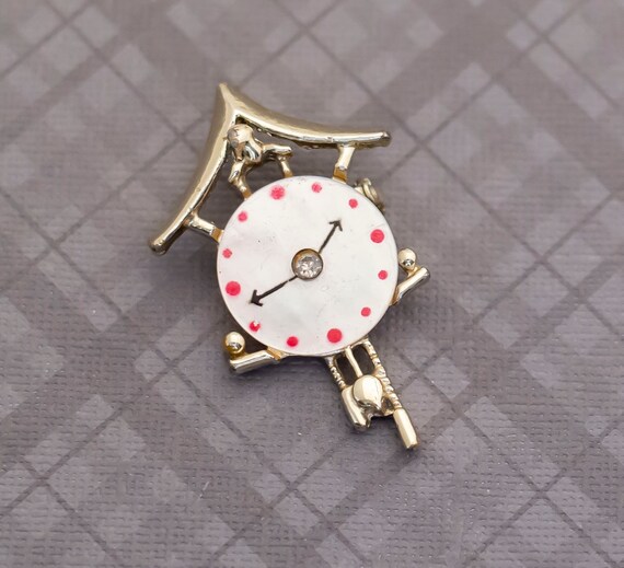 Clock brooch store