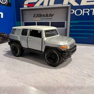 Matchbox Moving Parts Toyota FJ Cruiser With Real Riders off Road ...
