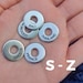 Country Travel Tokens S-Z for Keyrings | Engraved Travel Rings, Travel ...