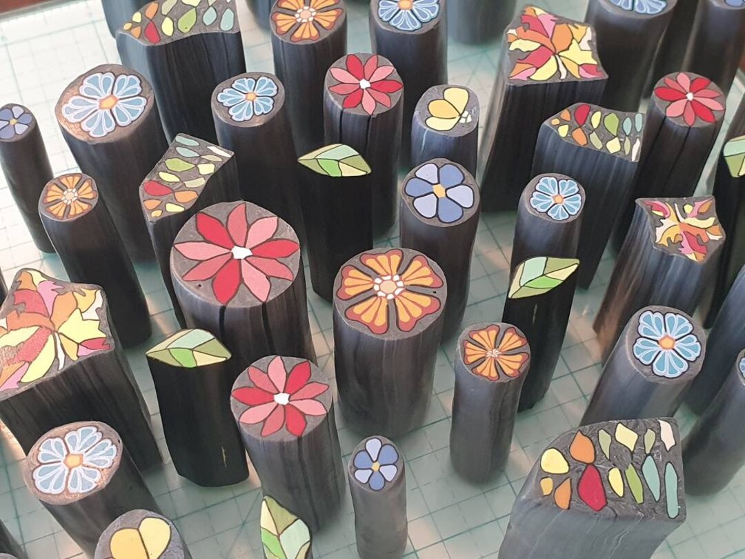 Selection of Polymer Clay Cane Fall Flowers and Leaves on a Neutral ...