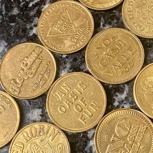 Group of 12 Animated Mascot Classic Arcade Video Game Amusement Tokens ...