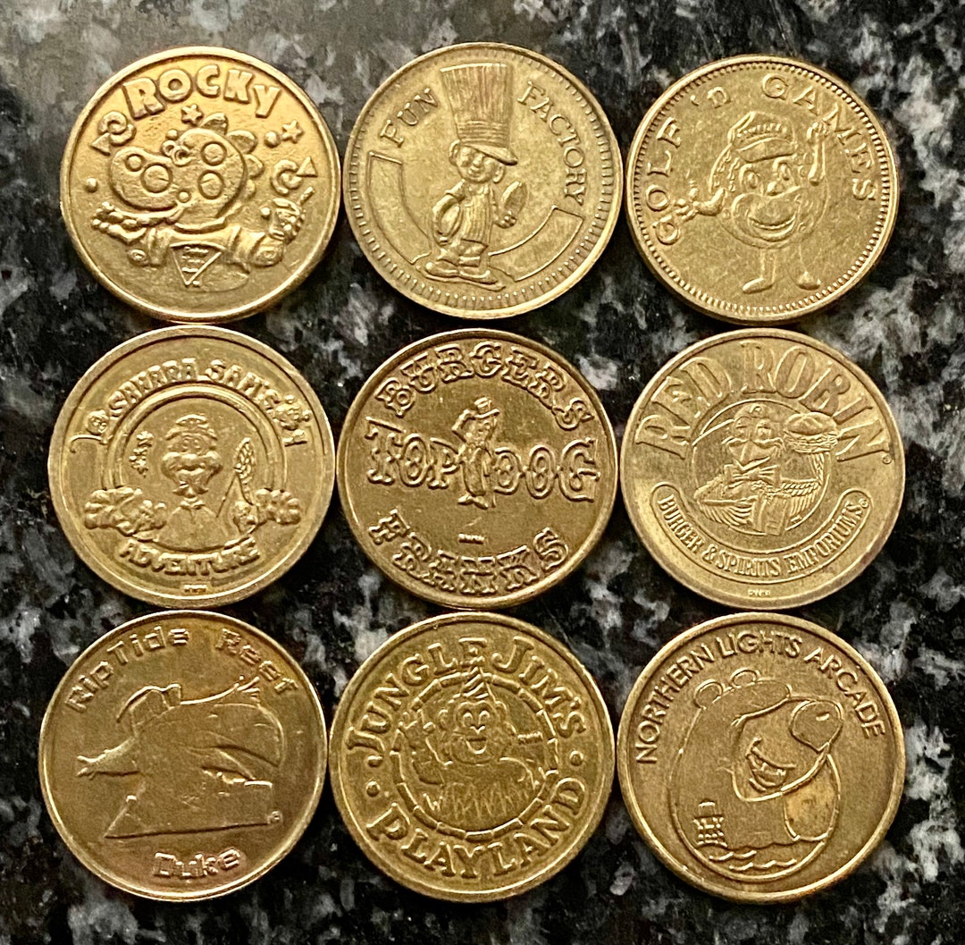 A Group of 9 Vintage Animated Character Arcade Game Amusement Tokens ...