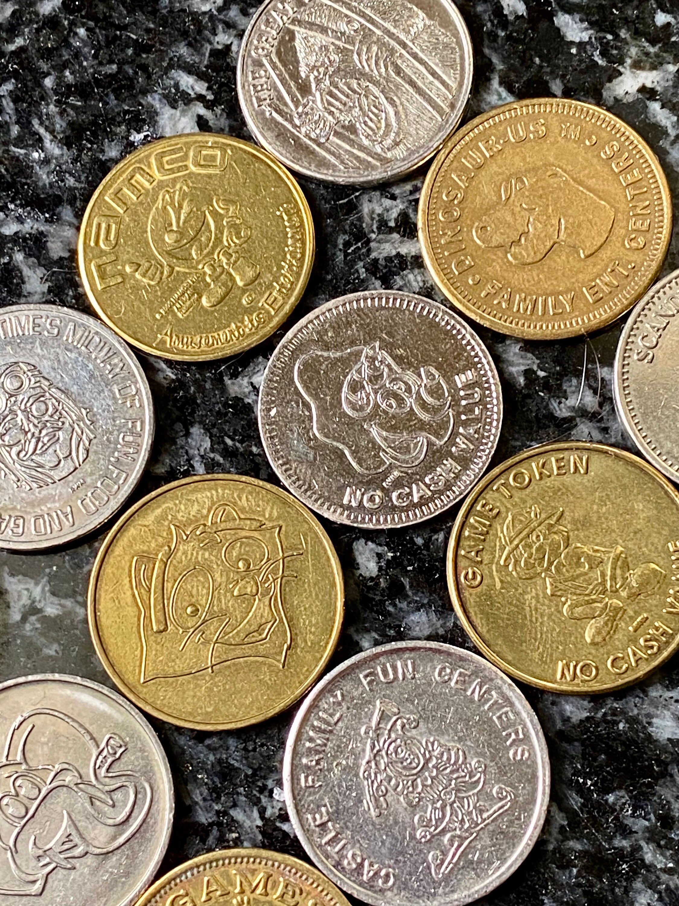 A Collection of 12 Vintage Animated Character Arcade Amusement Tokens ...